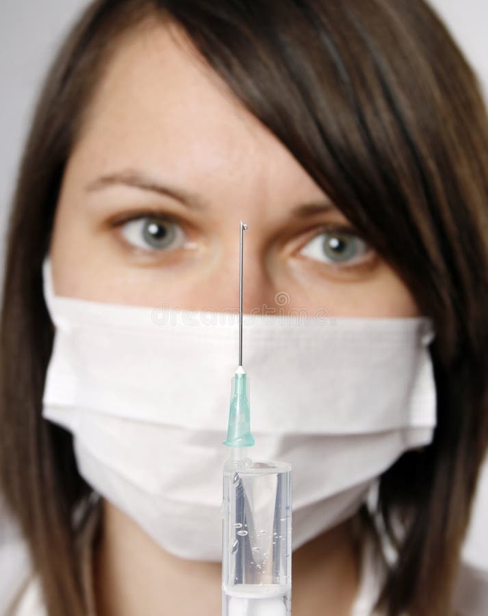 Nurse in mask with syringe stock photo. Image of professional - 19711160