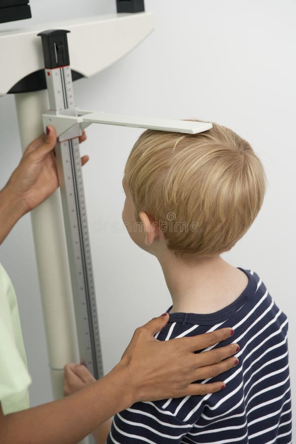 Nurse Measuring Boy S Height Stock Image - Image of child, indian: 29664049