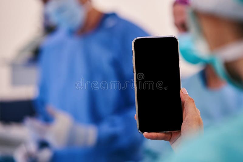 Nurse with Mobile Phone in a Plastic Surgery Room Stock Image - Image ...