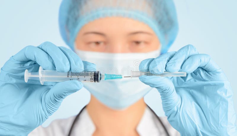 Nurse is opening syringe stock image. Image of female - 39642827