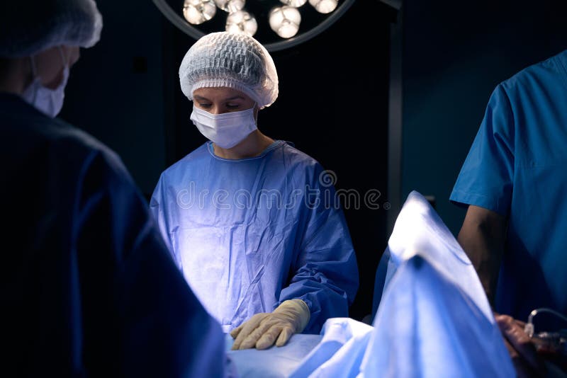 Nurse in an Operating Uniform Stands at the Surgical Table Stock Photo ...