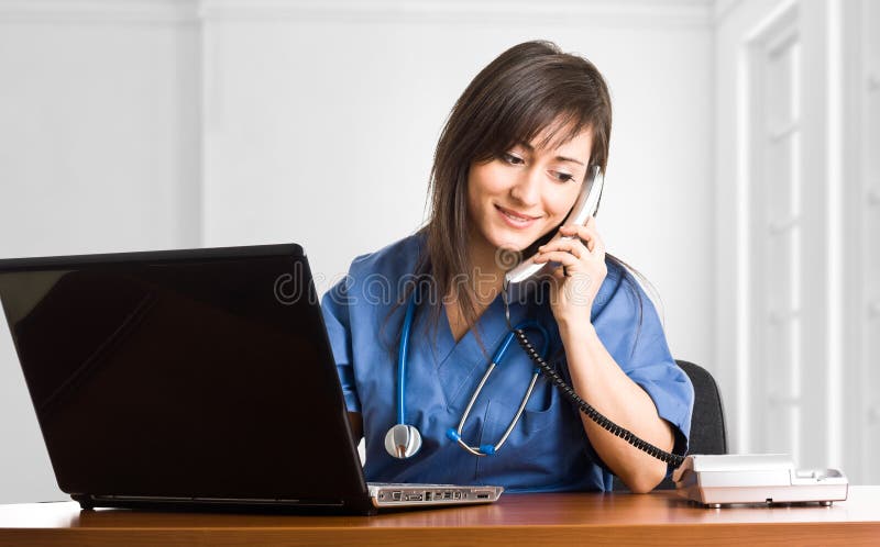 A Nurse on the Telephone stock photo. Image of station - 6446182