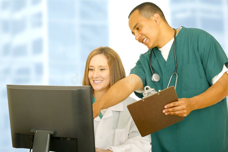 Nurse Pointing Computer Screen To Doctor Stock Photo - Image of male ...