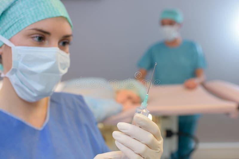 Nurse Preparing Injection for Waiting Patient Stock Photo - Image of ...