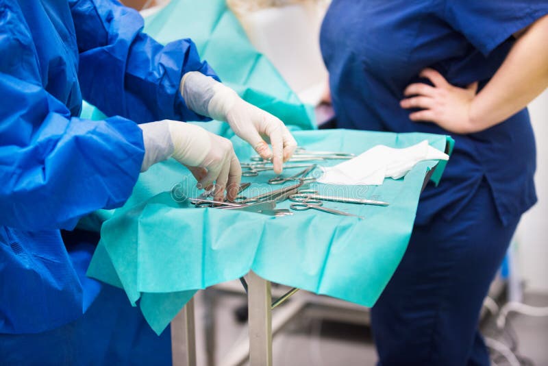 Nurse Preparing Medical Instruments for Operation Stock Photo - Image ...