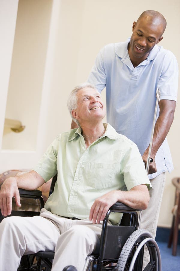Nurse Pushing Man in Wheelchair Stock Image - Image of middle, cheerful ...