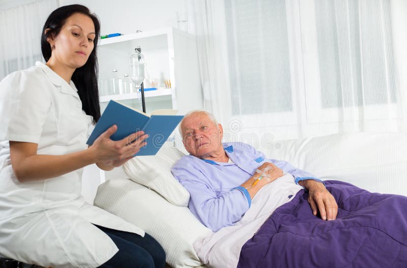 Nurse Reading a Book To His Patient Stock Image - Image of fluid ...