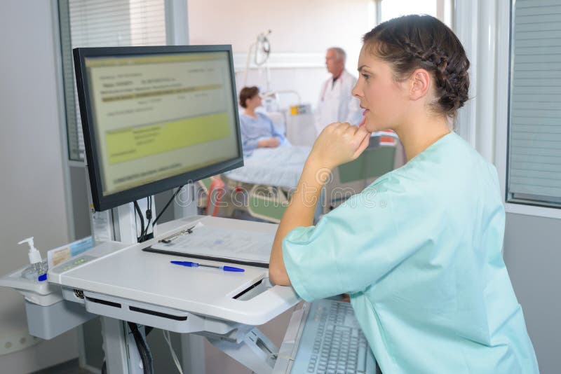 Nurse Reading Patient S Notes on Computer Screen Stock Image - Image of ...