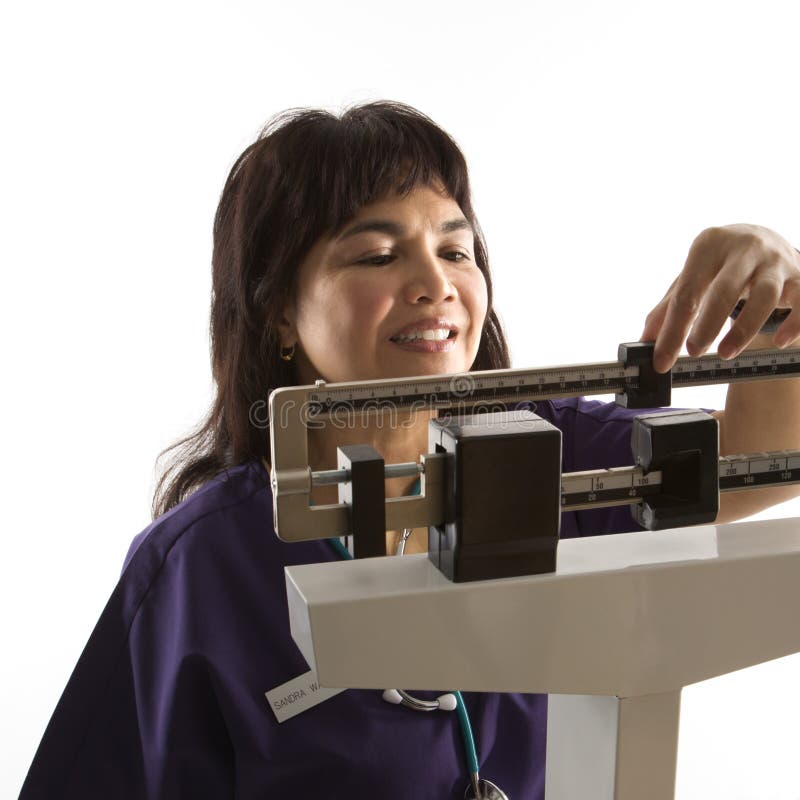 Nurse Reading Weight on Scale. Stock Photo - Image of weight, shot: 2042496
