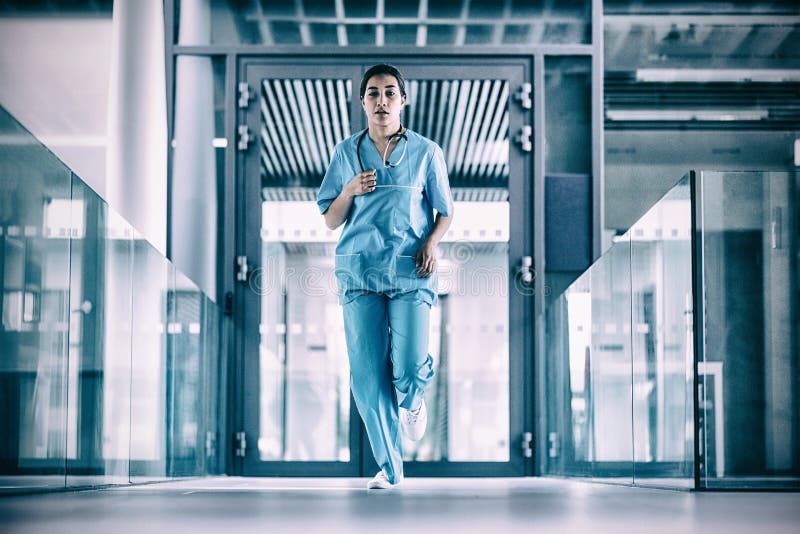 Nurse Running in Hospital Corridor Stock Image - Image of computer ...