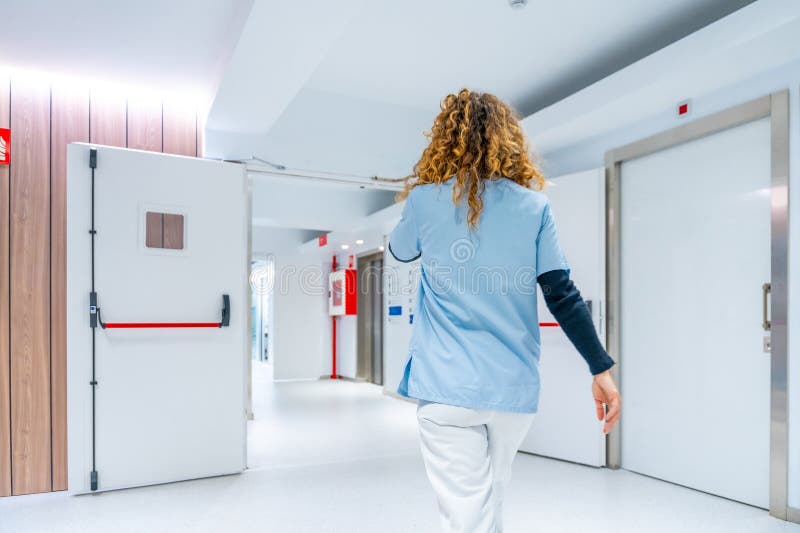 Nurse in a Rush Along Emergency Area of an Hospital Stock Photo - Image ...