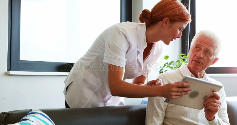 Nurse and Senior Patient Using Tablet Computer Stock Video - Video of ...