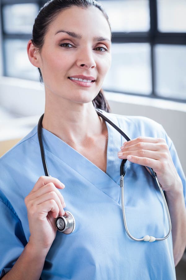 Nurse Smiling at the Camera Stock Image - Image of smiling, indoors ...