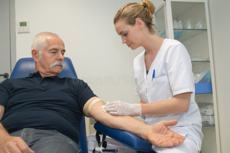 Nurse Taking Blood from Elderly Male Patient Stock Photo - Image of ...