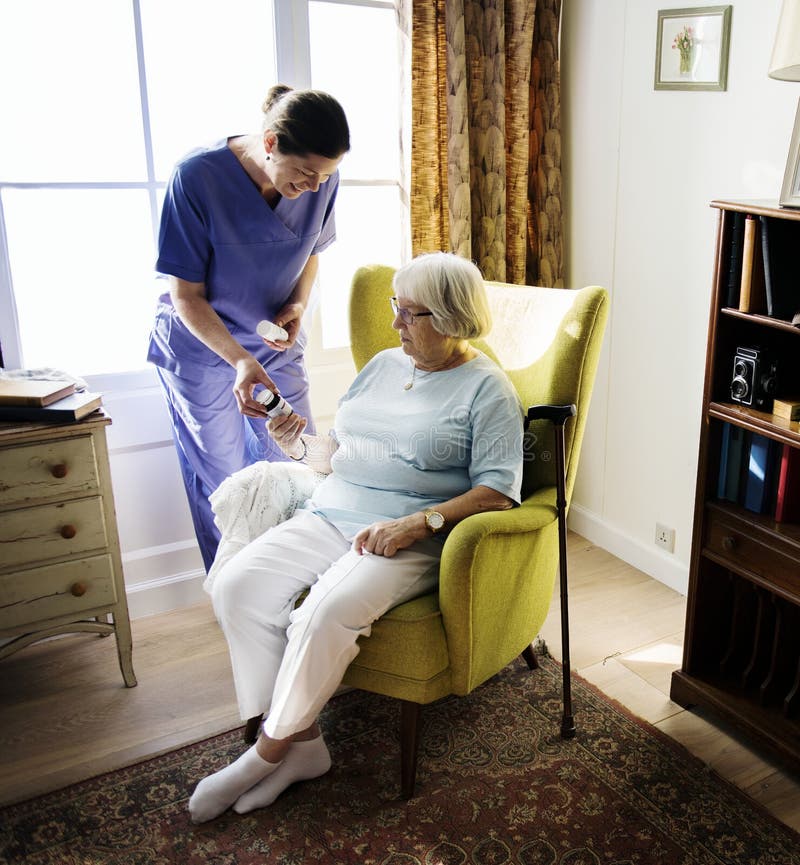 Nurse is Taking Care of a Senior Woman Stock Image - Image of resting ...