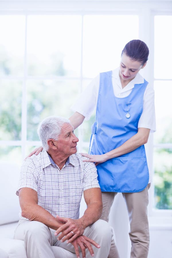 Nurse Taking Care of Sick Elderly Patient Stock Photo - Image of ...