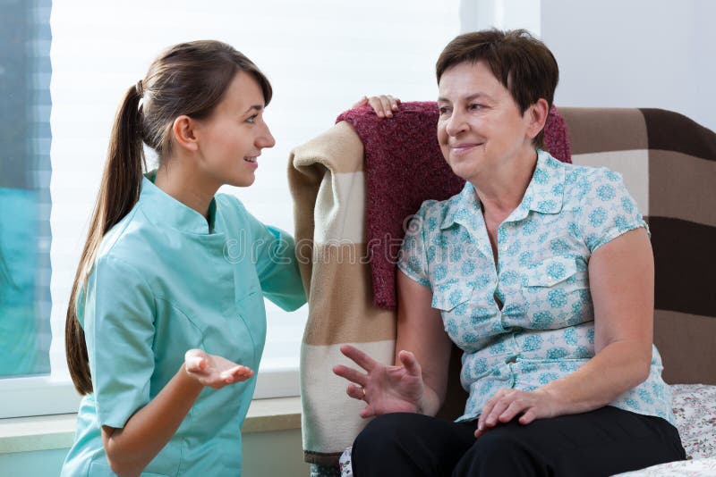 Nurse talking with patient stock image. Image of elderly - 48387547