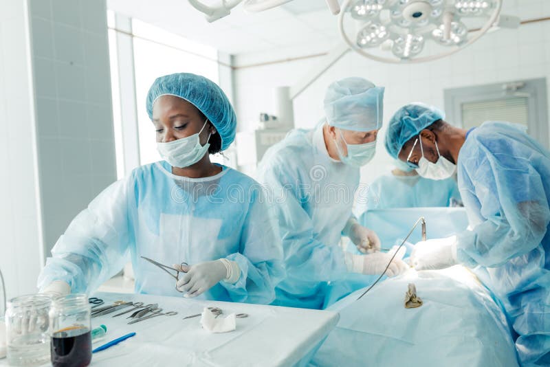 Nurse and Team of Talented Doctors Using Cutting and Dissecting ...