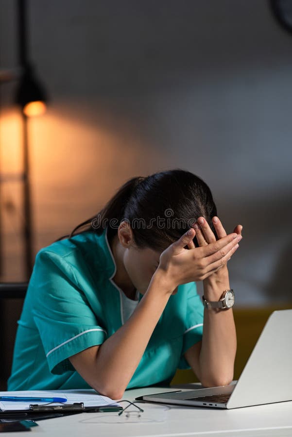 Nurse in Uniform Sitting at Table and Sleeping Stock Photo - Image of ...