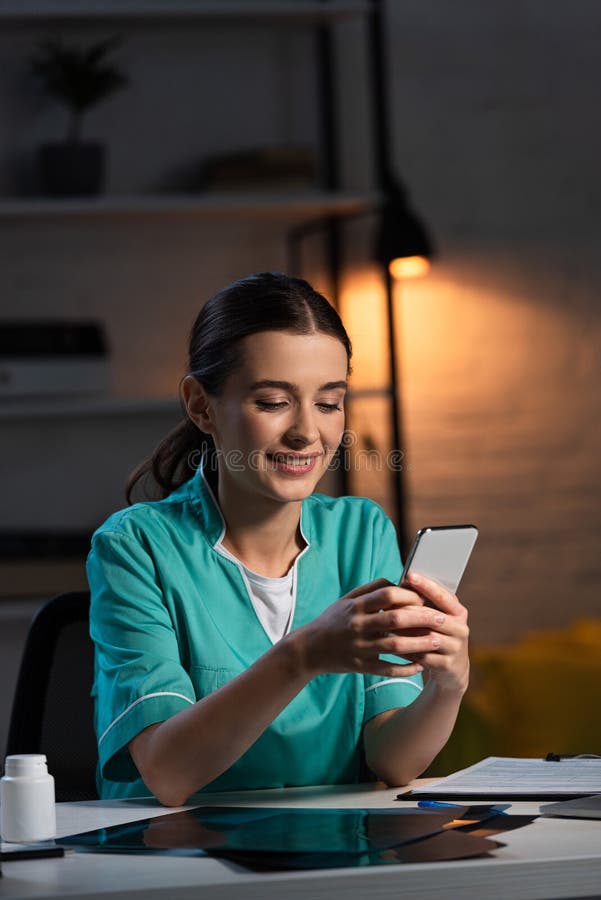 Nurse in Uniform Sitting at Table Stock Photo - Image of table ...