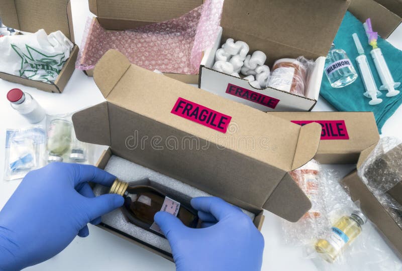 Nurse Unpacking Medication in Boxes, Pasting Label Return To the ...