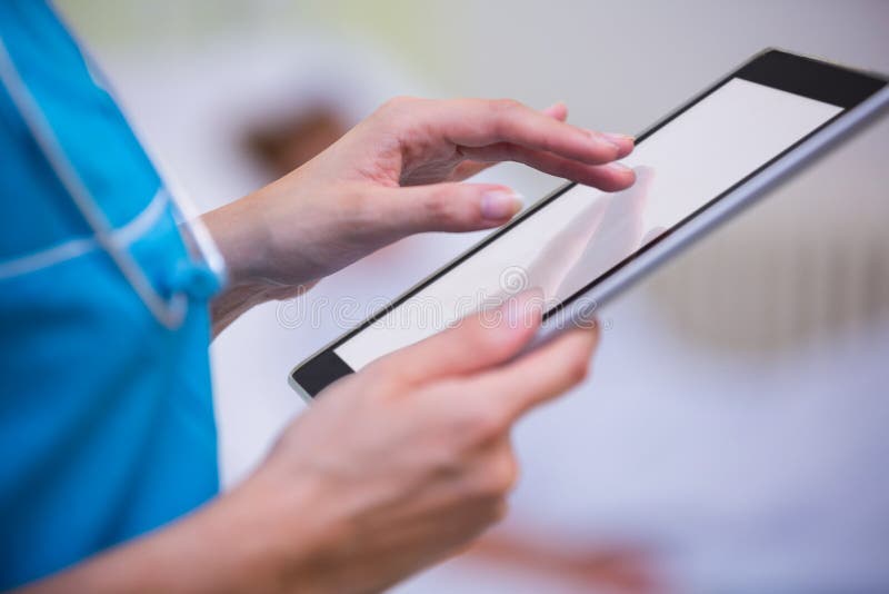 Nurse Using Digital Tablet in Hospital Ward Stock Photo - Image of ...