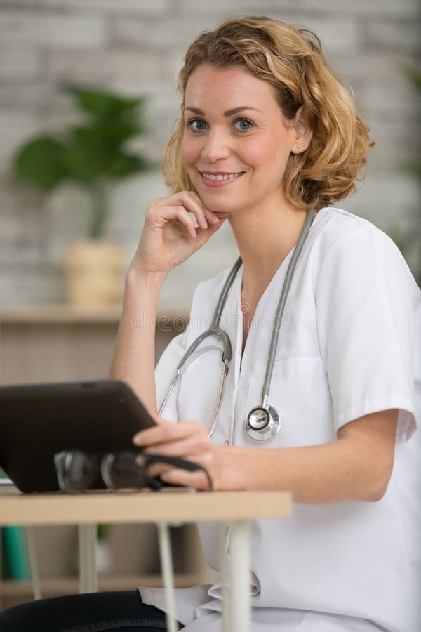 Nurse using tablet pc stock image. Image of healthcare - 260342489