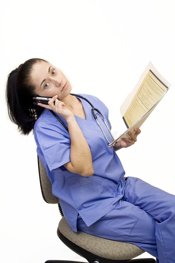 Nurse Reading Chart stock photo. Image of girls, folder - 20826852