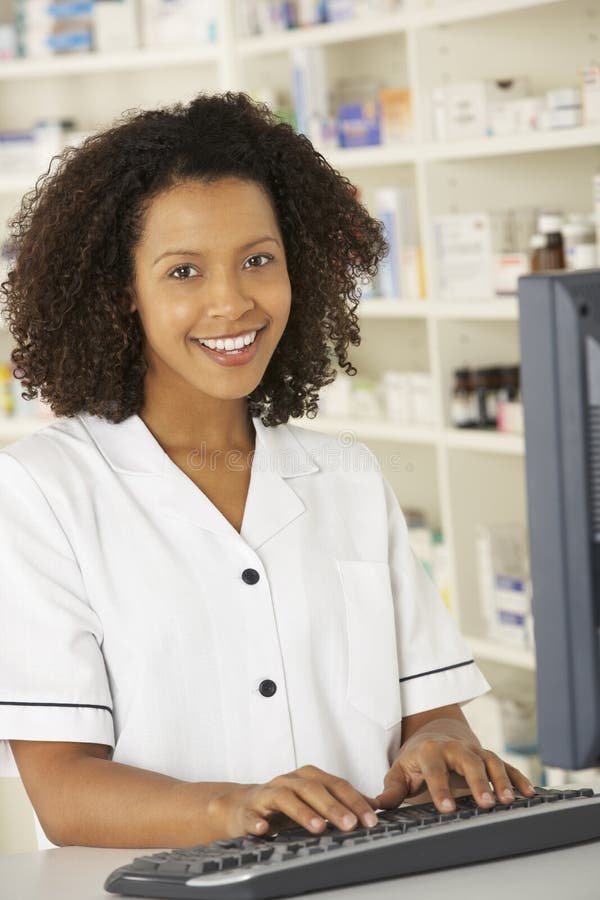 Nurse Working on Computer in Pharmacy Stock Image - Image of people ...