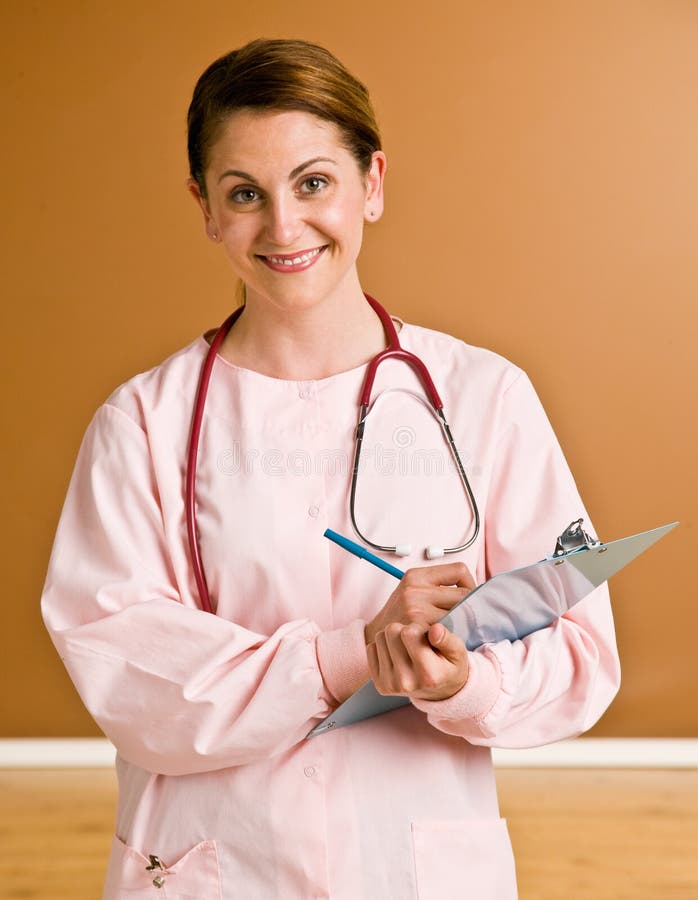 Nurse writing on clipboard stock image. Image of chart - 7667973