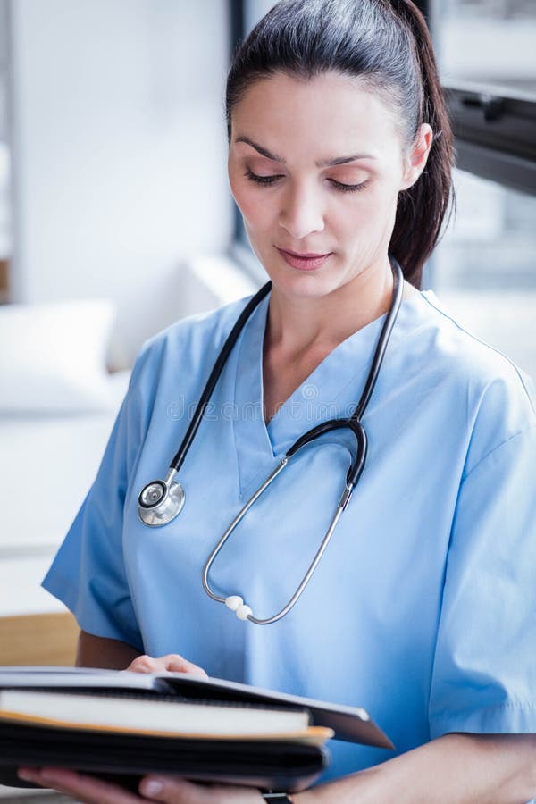 Nurse writing in her diary stock photo. Image of diary - 66435054