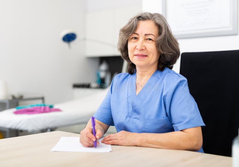 Nurse Writing Medical History on Patient Card Stock Photo - Image of ...