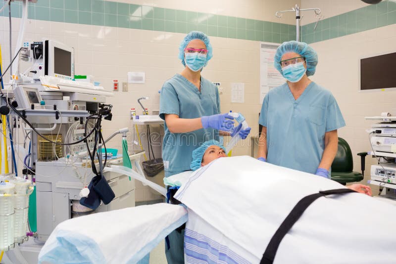 Nurses with Oxygen Mask Preparing Patient Stock Photo - Image of ...