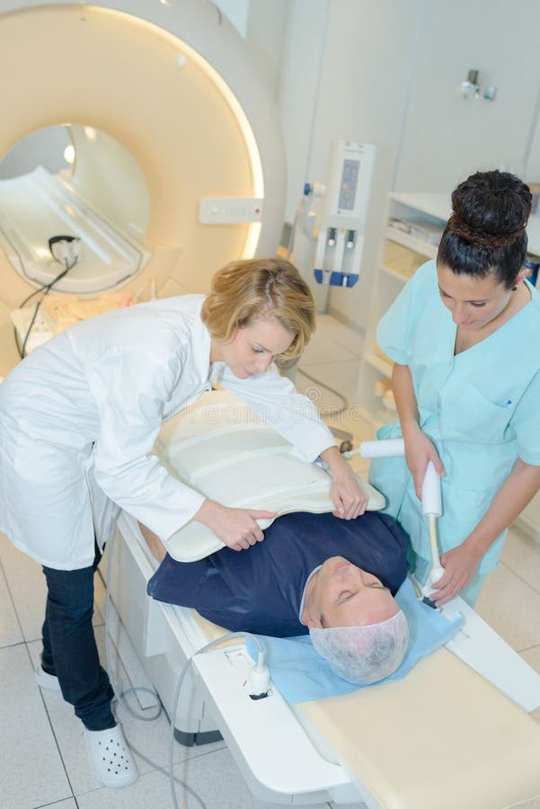 Nurses Preparing Patient for Mri Scan Stock Image - Image of ...