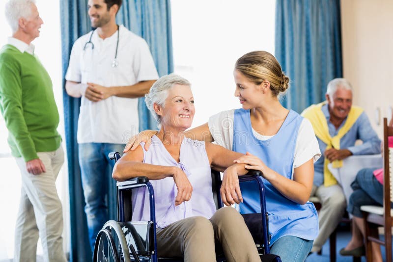 Nurses Taking Care Of Seniors Stock Photo - Image of friendship, health ...