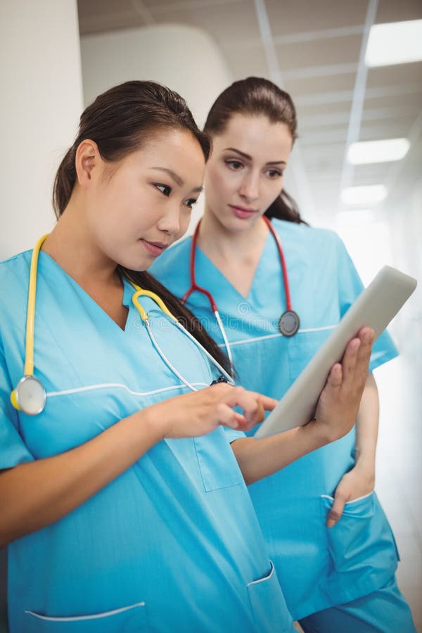 Nurses Using Digital Tablet Stock Photo - Image of hands, connection ...
