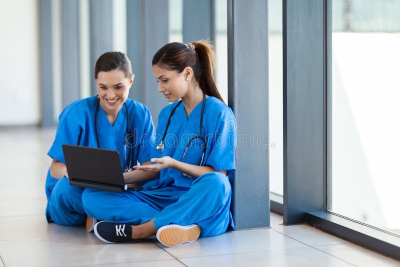 Nurses using laptop stock image. Image of modern, doctors - 27013695