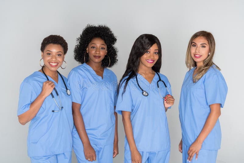 Two Female Nurses Standing in a Hospital Corridor Stock Image - Image ...