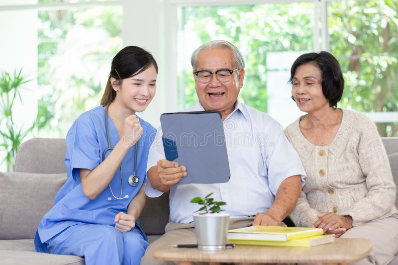 Nursing Home Care Concept. Elderly Use Tablet To Video Call To Family ...