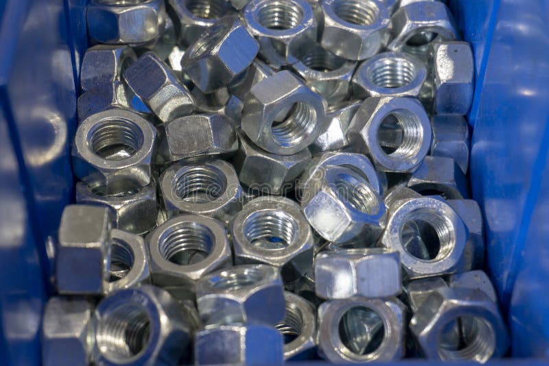 Nut Fixing Connection, Set of New Nuts in a Blue Box Stock Photo ...