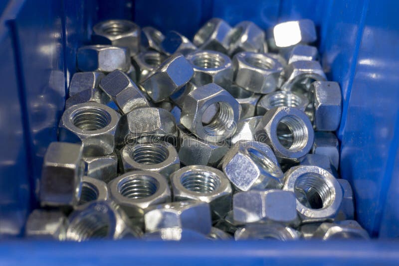Nut Fixing Connection, Set of New Nuts in a Blue Box Stock Photo ...