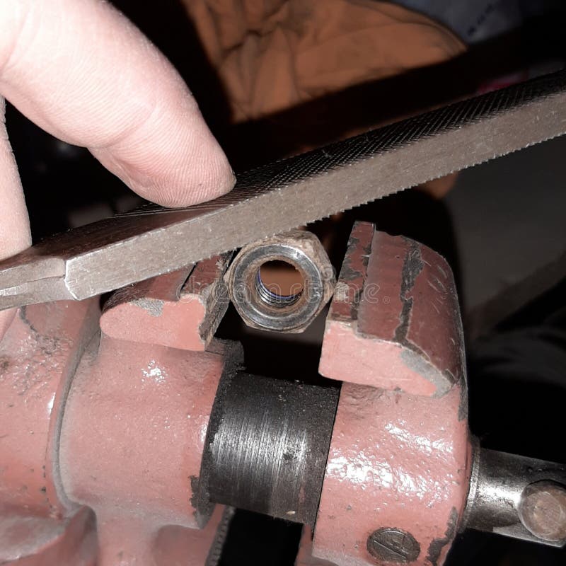 A Nut Made by File with Vise and Arm Stock Photo - Image of vise, file ...