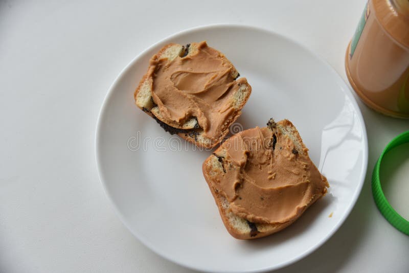 Nut Paste Spread on a Piece of Bread on a Plate Stock Photo - Image of ...