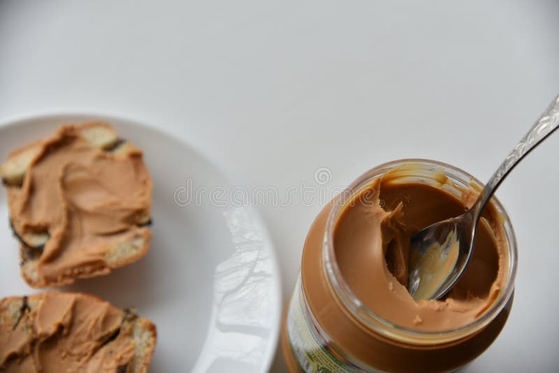 Nut Paste Spread on a Piece of Bread on a Plate Stock Image - Image of ...