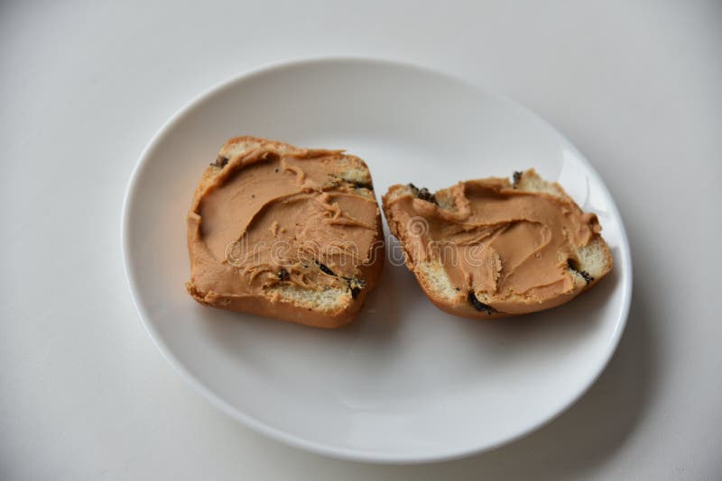 Nut Paste Spread on a Piece of Bread on a Plate Stock Photo - Image of ...