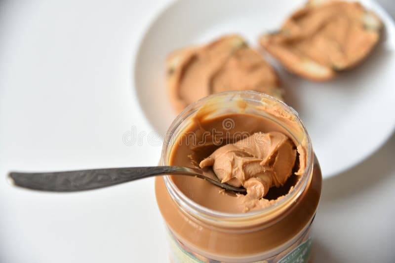 Nut Paste Spread on a Piece of Bread on a Plate Stock Photo - Image of ...