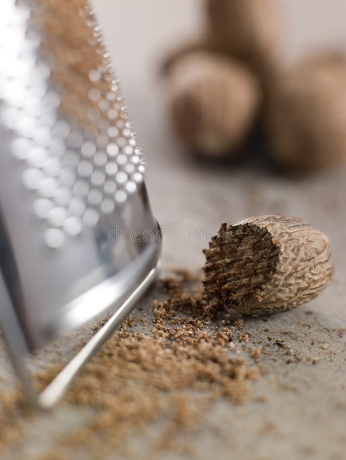 Nutmeg and Grater stock photo. Image of shot, colour, ingredients - 7230262