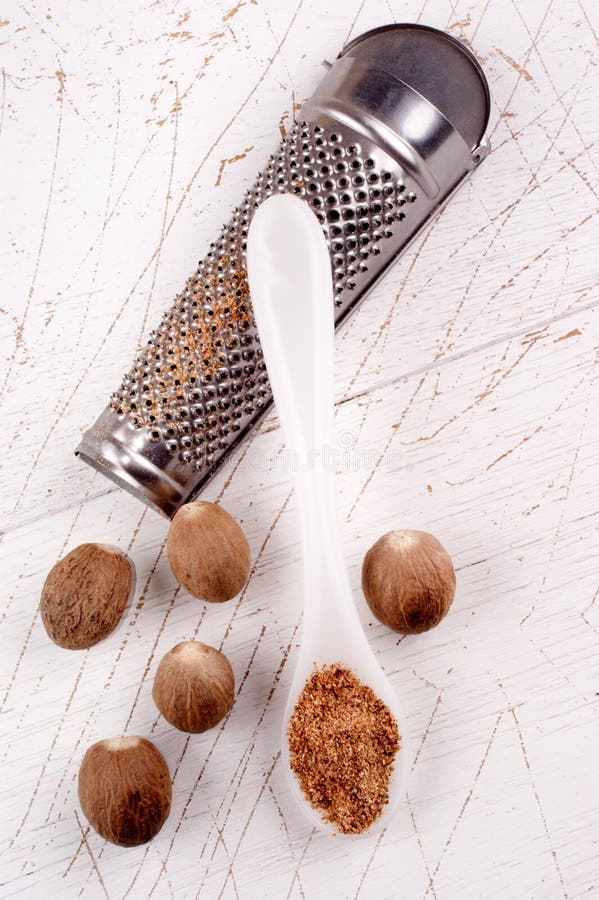 Nutmeg Powder and Whole Nutmeg Nuts Stock Photo - Image of powder ...