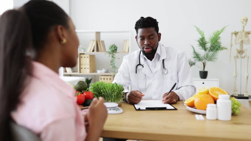 Nutrition Expert Making Notes during Talk with Patient Stock Footage ...