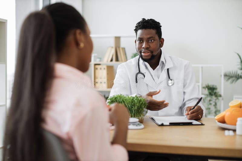 Nutrition Expert Making Notes during Talk with Patient Stock Image ...